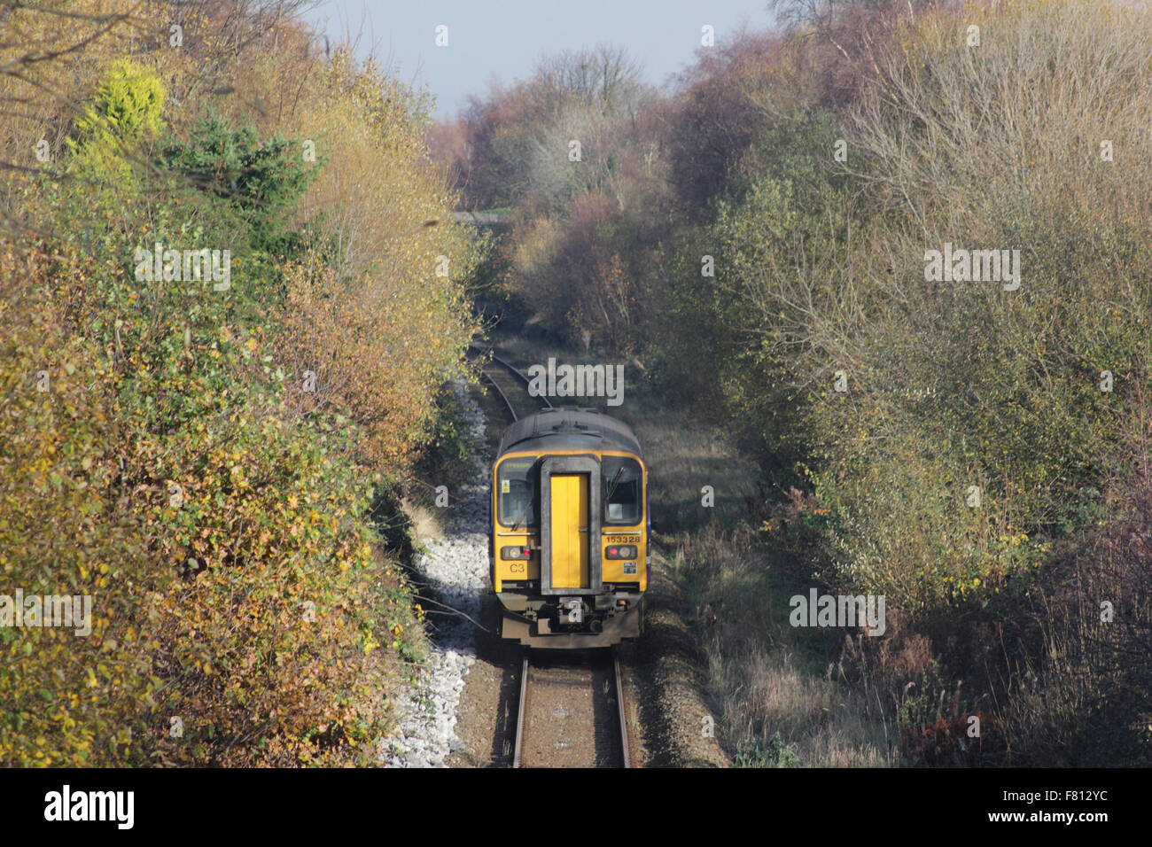 Rural train service approaches Burscough Junction station along a ...