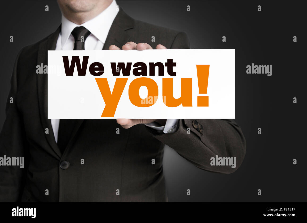 We want you; sign is held by businessman concept Stock Photo - Alamy