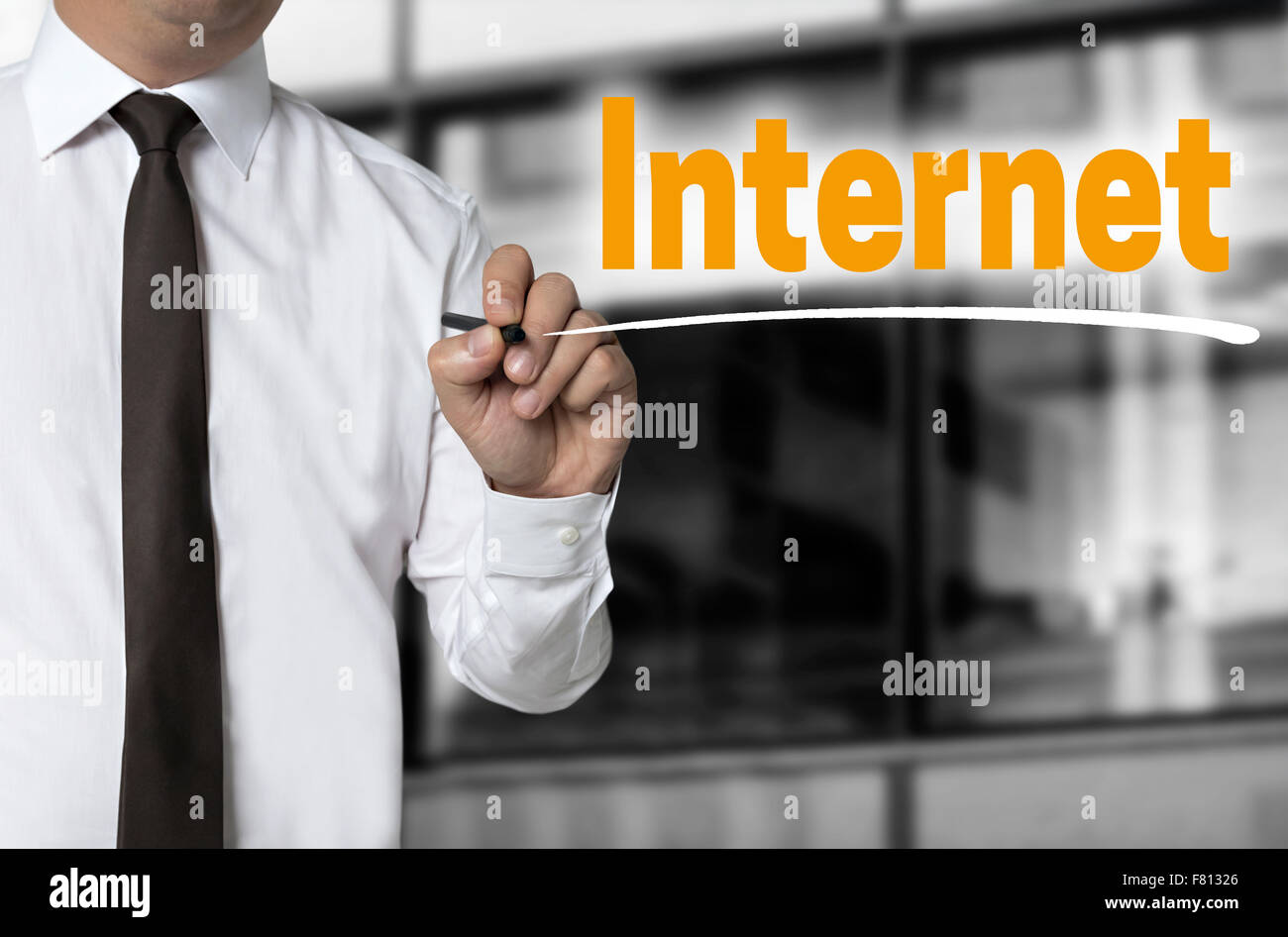 Internet is written by businessman background concept Stock Photo - Alamy