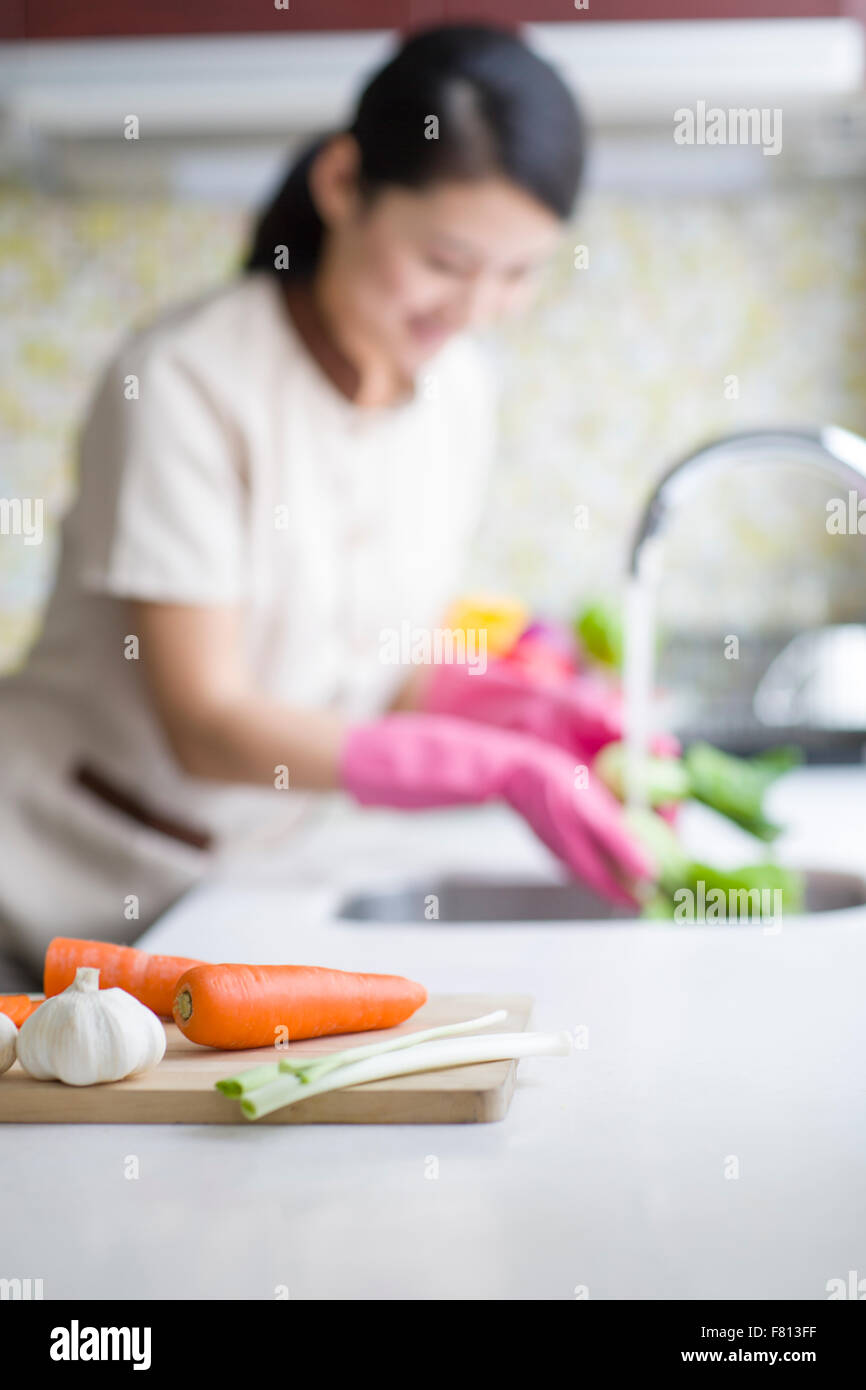 Domestic staff washing vegetables Stock Photo - Alamy