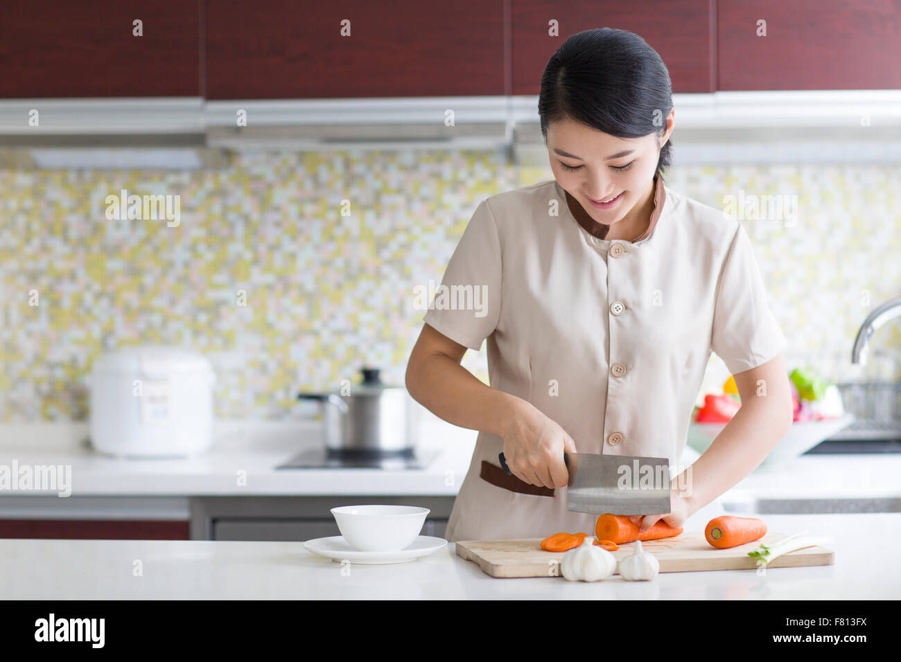 Domestic staff cooking in kitchen Stock Photo - Alamy