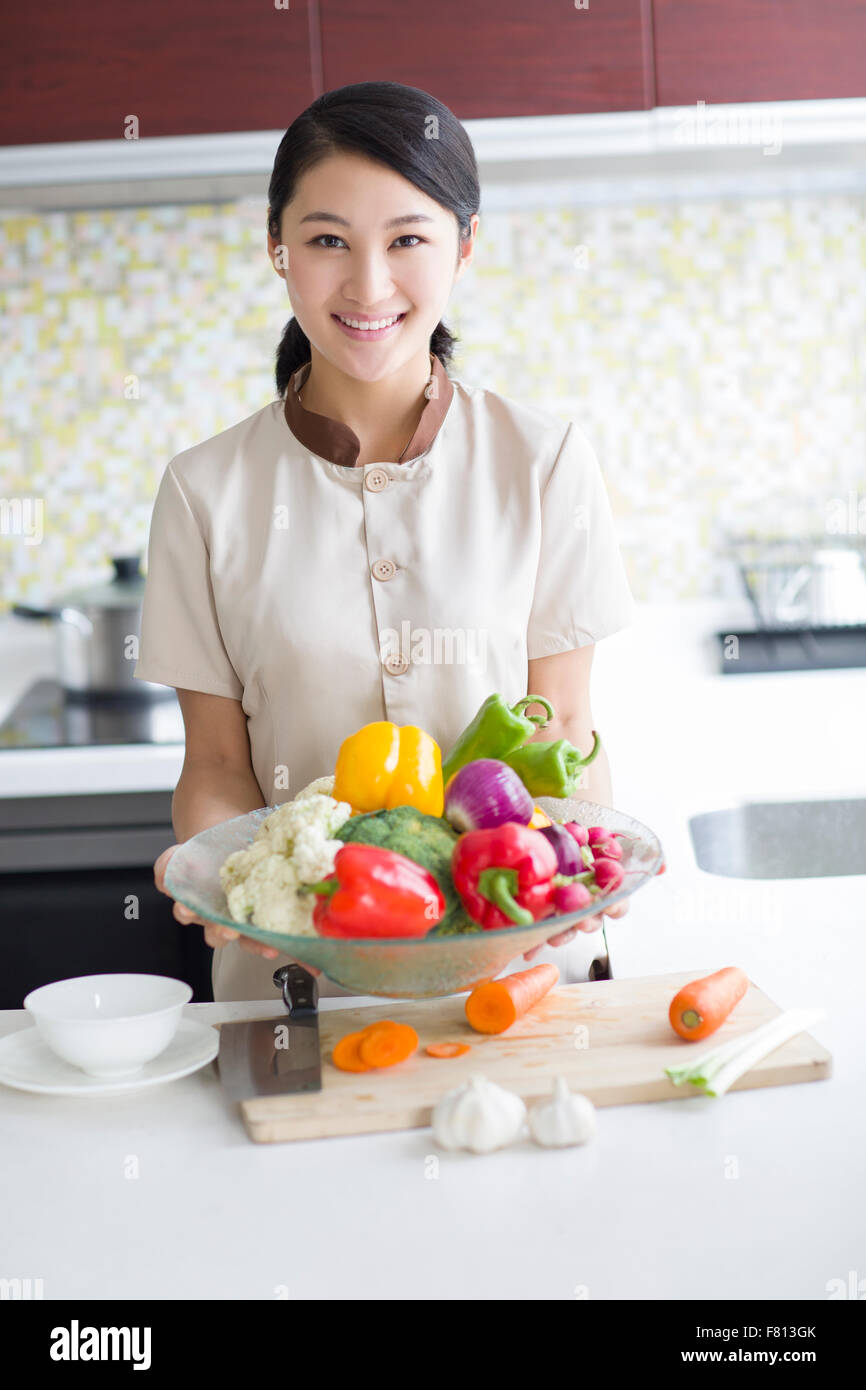 Domestic staff cooking in kitchen Stock Photo - Alamy