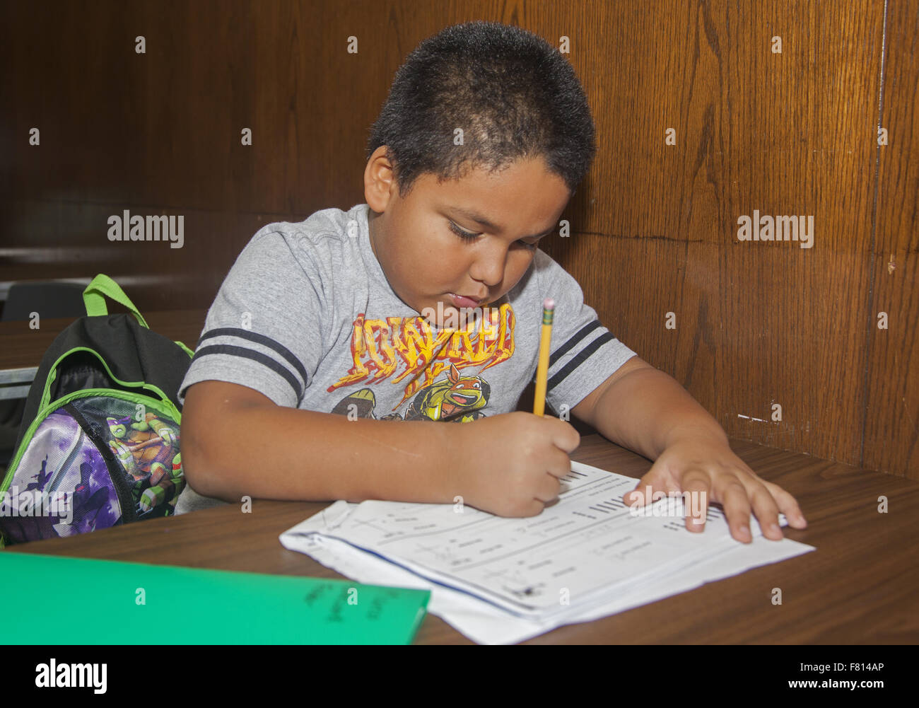Children study and do homework after school at a community center ...