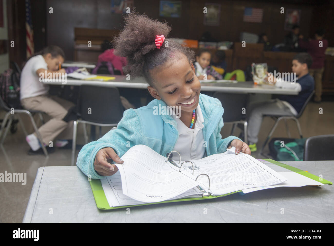 Children study and do homework after school at a community center ...