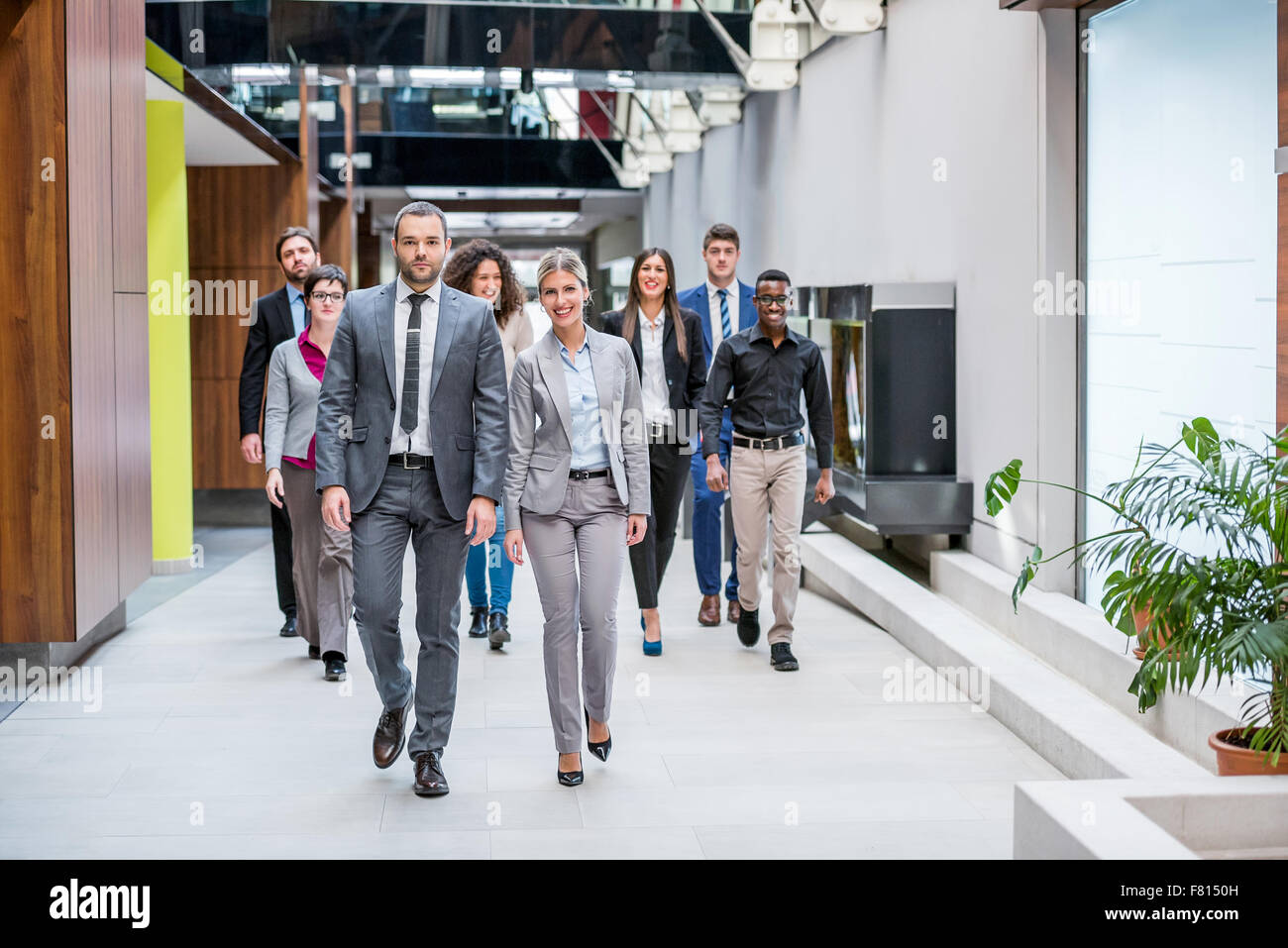 young multi ethnic business people group walking standing and top view Stock Photo - Alamy