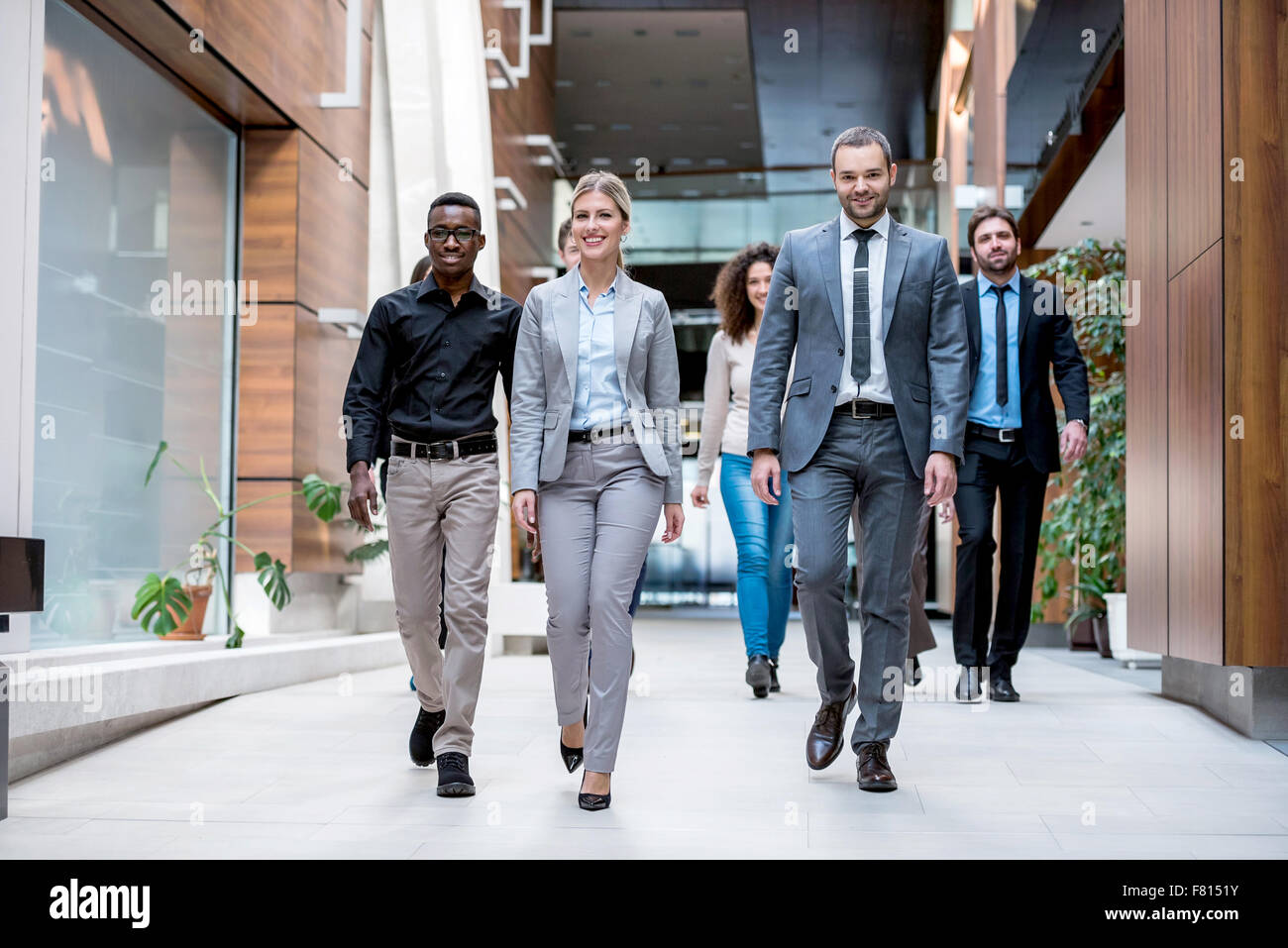 young multi ethnic business people group walking standing and top view Stock Photo - Alamy