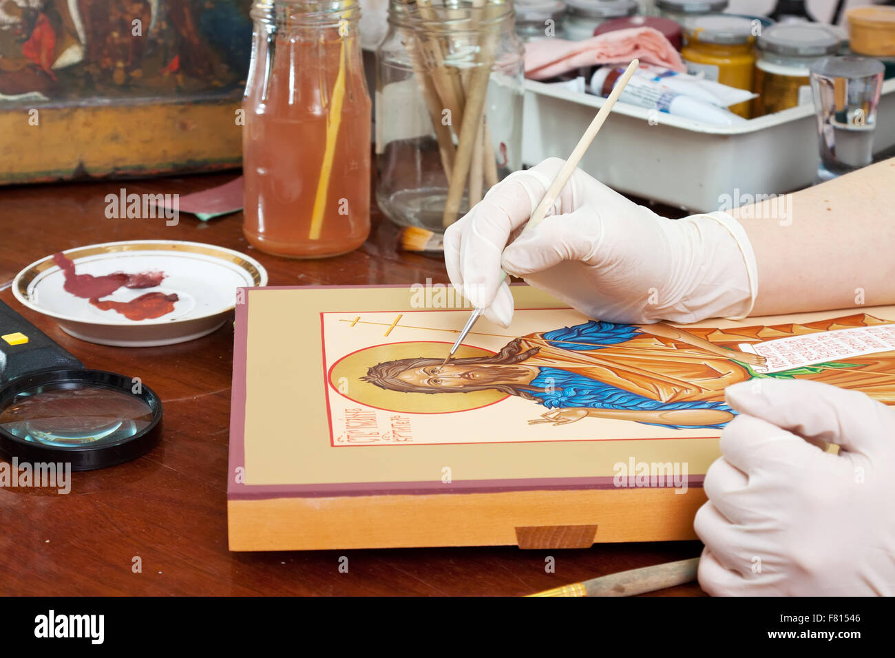 Iconographer makes new icon at painting workshop Stock Photo - Alamy
