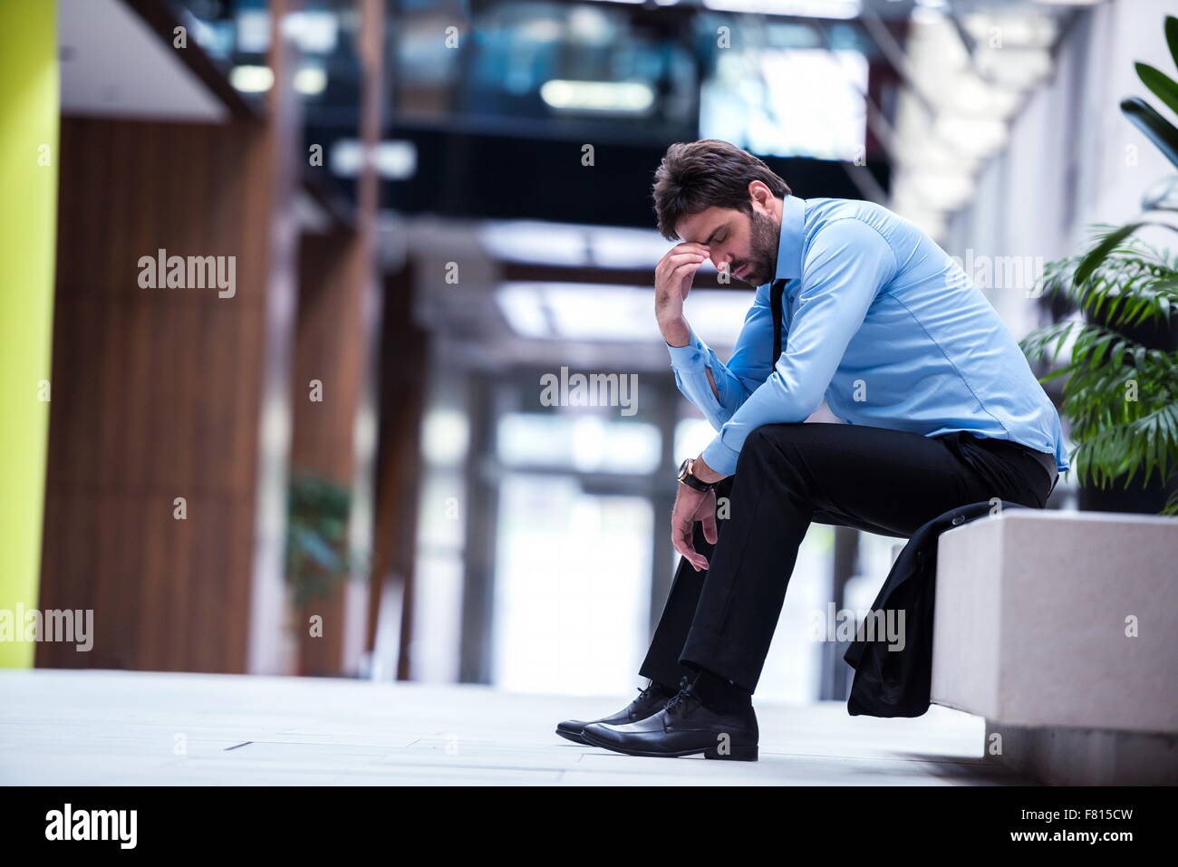 frustrated young business man working on laptop computer at office ...