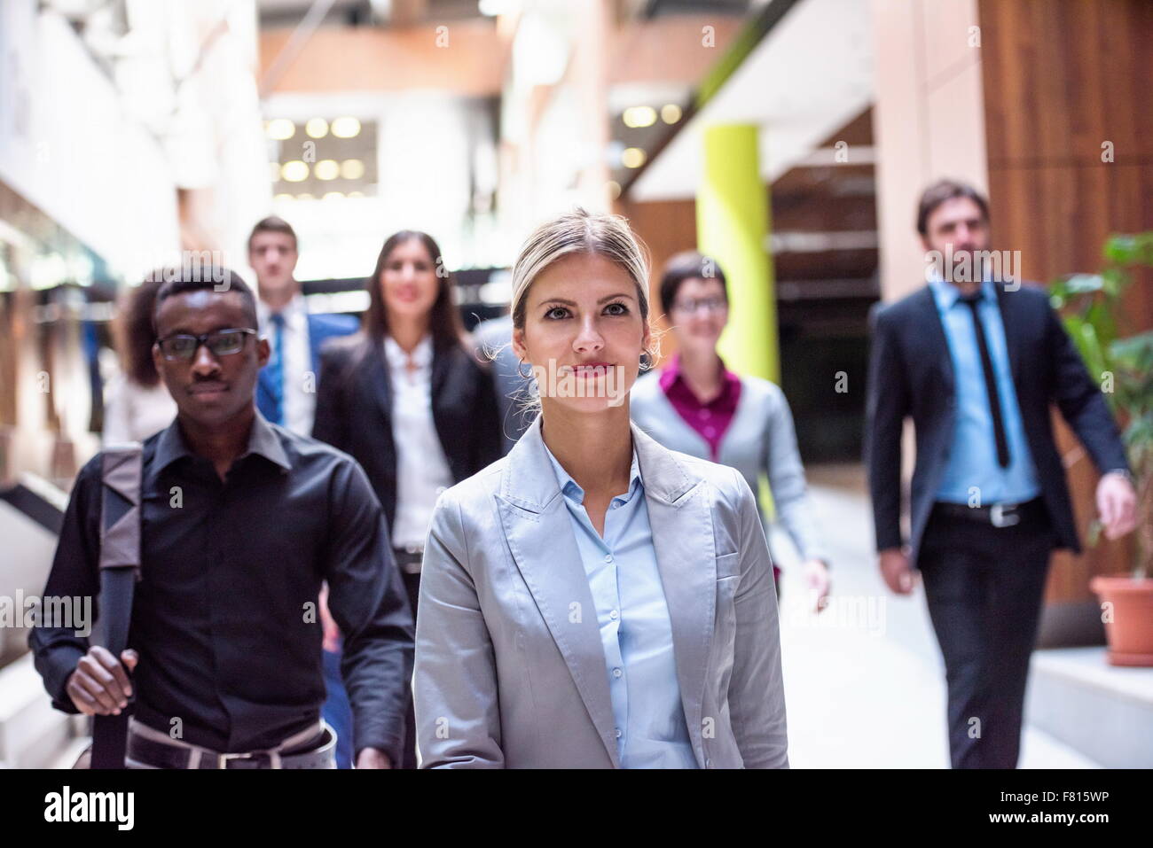 young multi ethnic business people group walking standing and top view Stock Photo - Alamy