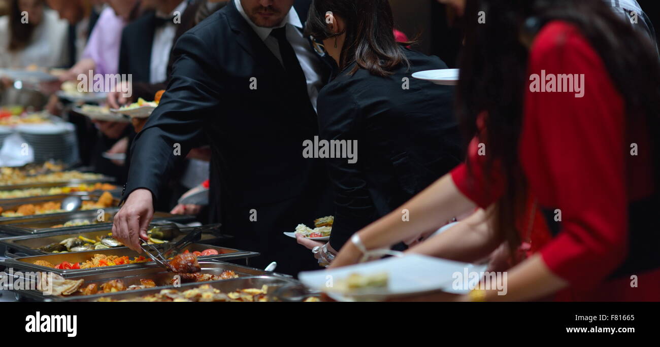 people group catering buffet food indoor in luxury restaurant with meat ...