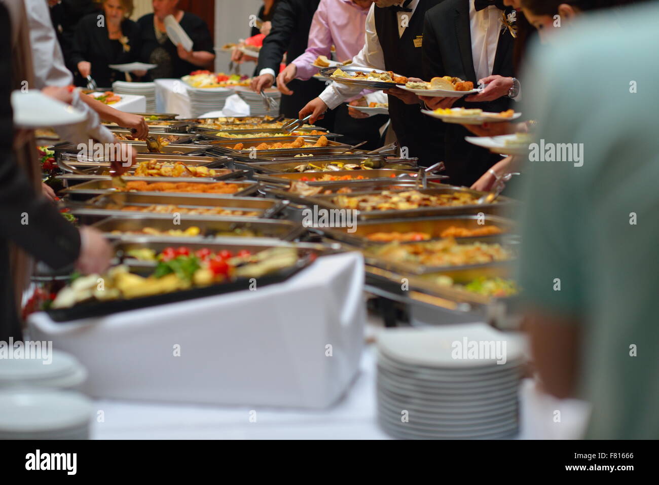 people group catering buffet food indoor in luxury restaurant with meat ...