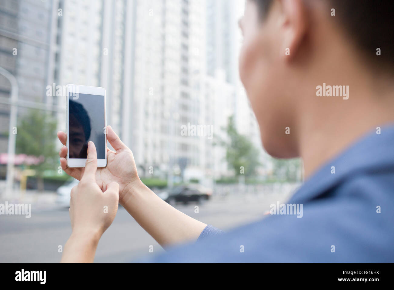 Young man using smart phone Stock Photo - Alamy