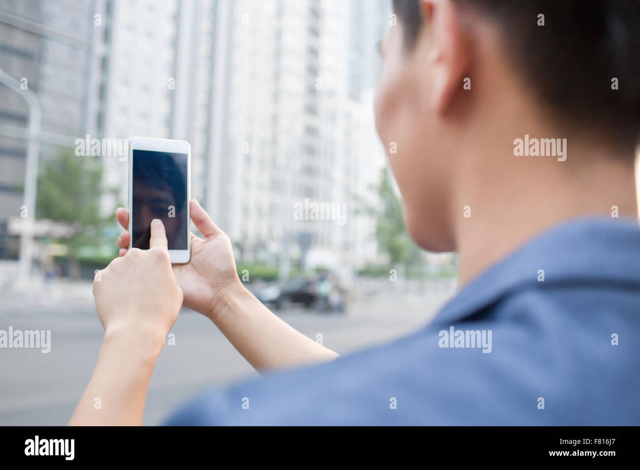 Young man using smart phone Stock Photo - Alamy