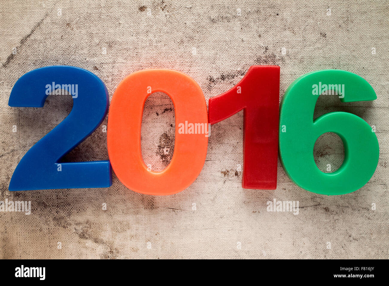 2016 colorful plastic number on the old canvas background Stock Photo ...