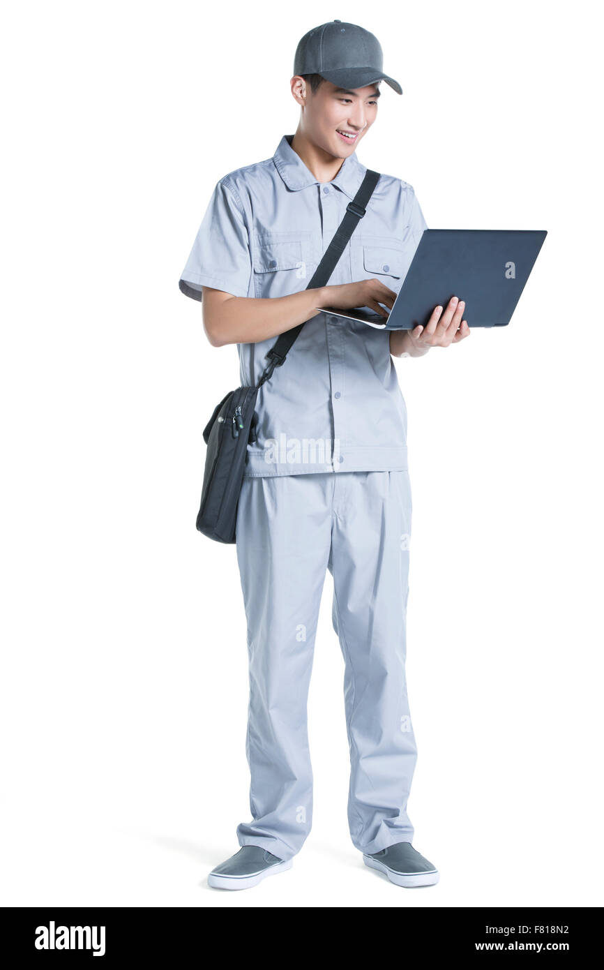 Engineer using laptop computer Cut Out Stock Images & Pictures - Alamy