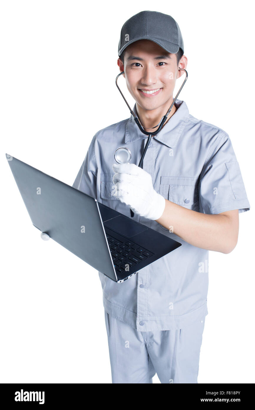 Engineer checking laptop Stock Photo - Alamy