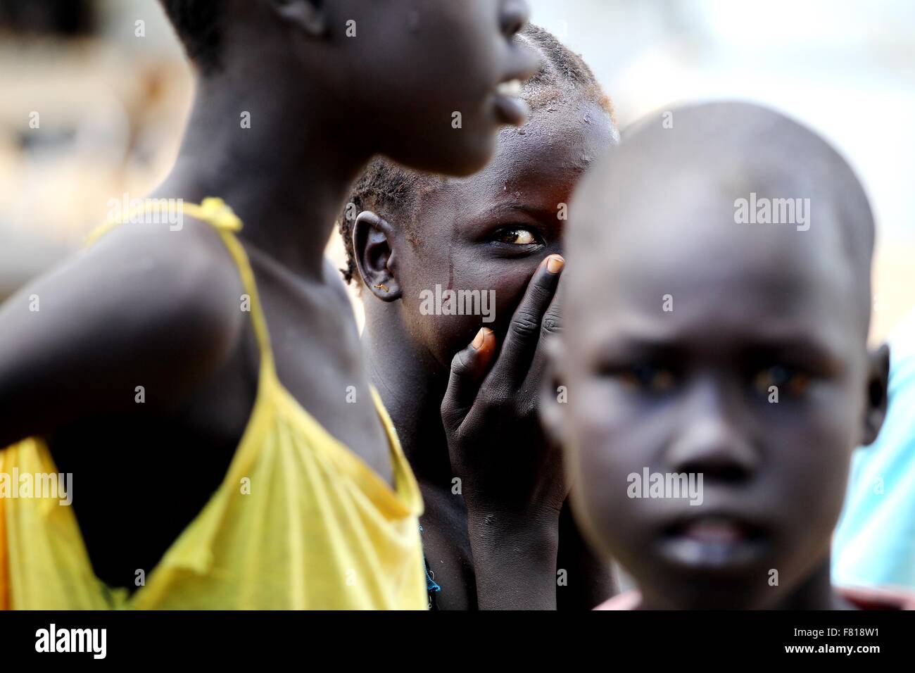A young girl have a smile as their photo is taken in an Internally ...