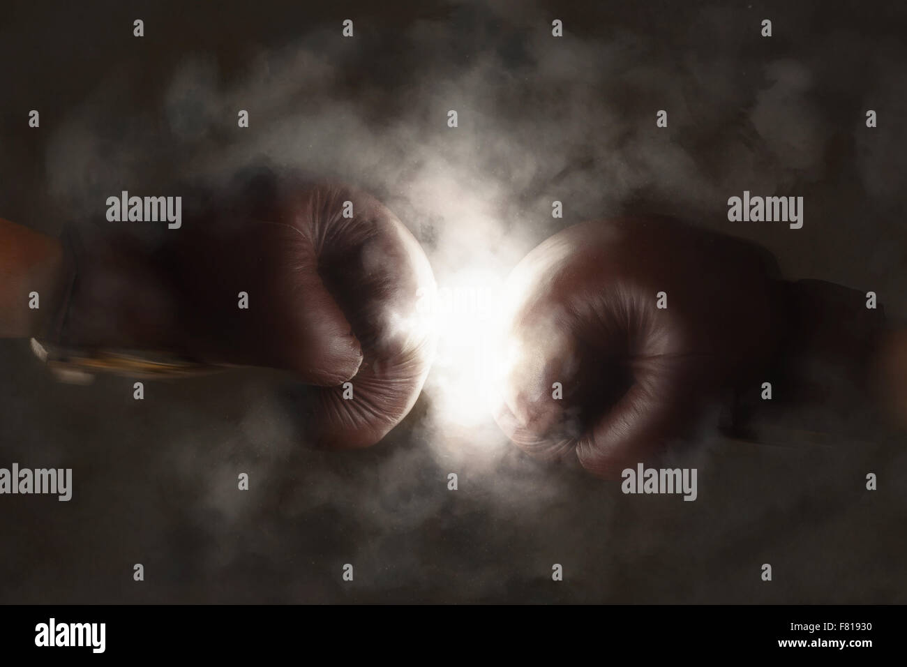 Two brown old boxing gloves hit together Stock Photo - Alamy