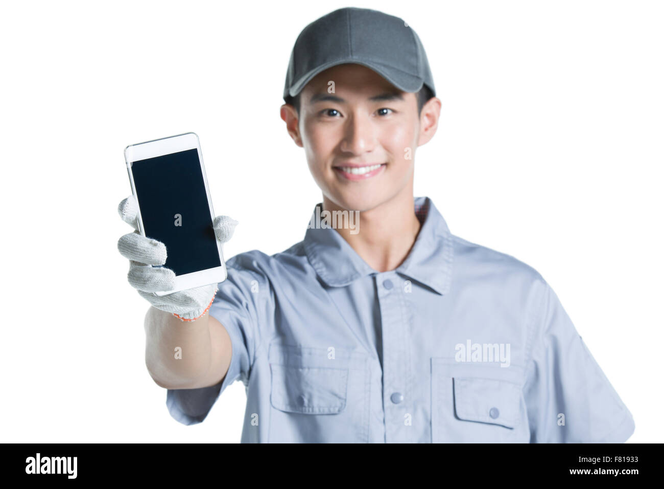Technician showing smart phone Stock Photo - Alamy