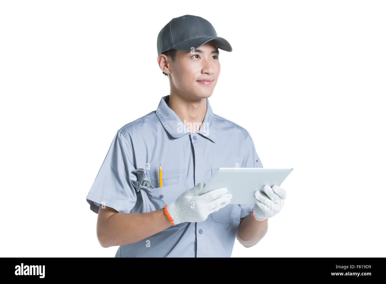 Repairman holding a digital tablet Stock Photo - Alamy