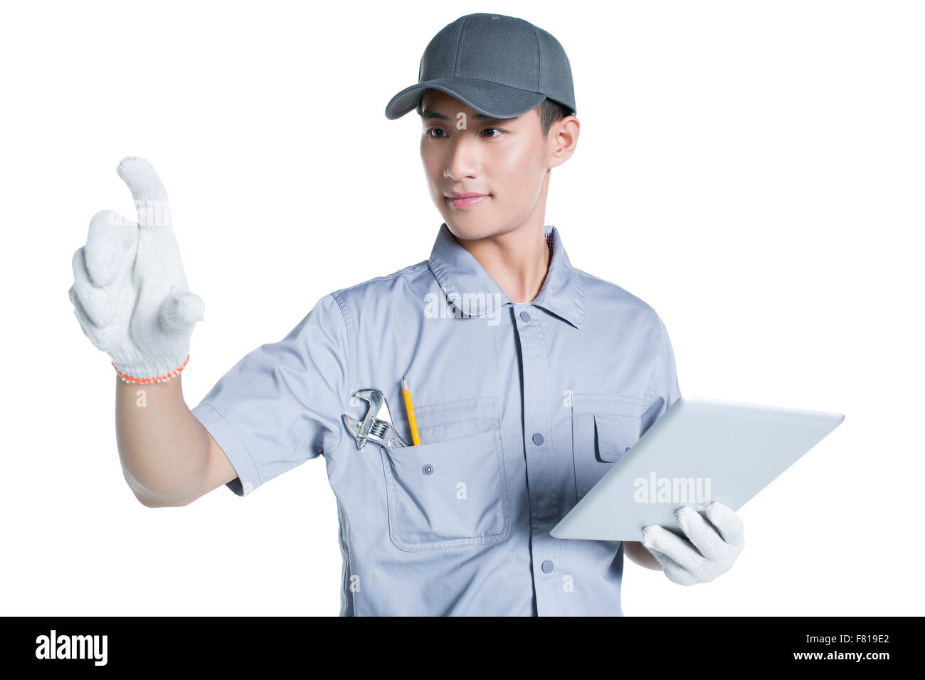 Repairman holding a digital tablet Stock Photo - Alamy