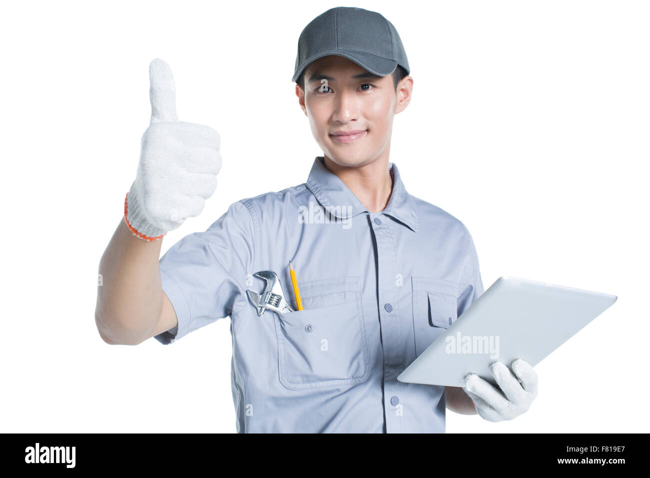 Repairman holding a digital tablet Stock Photo - Alamy