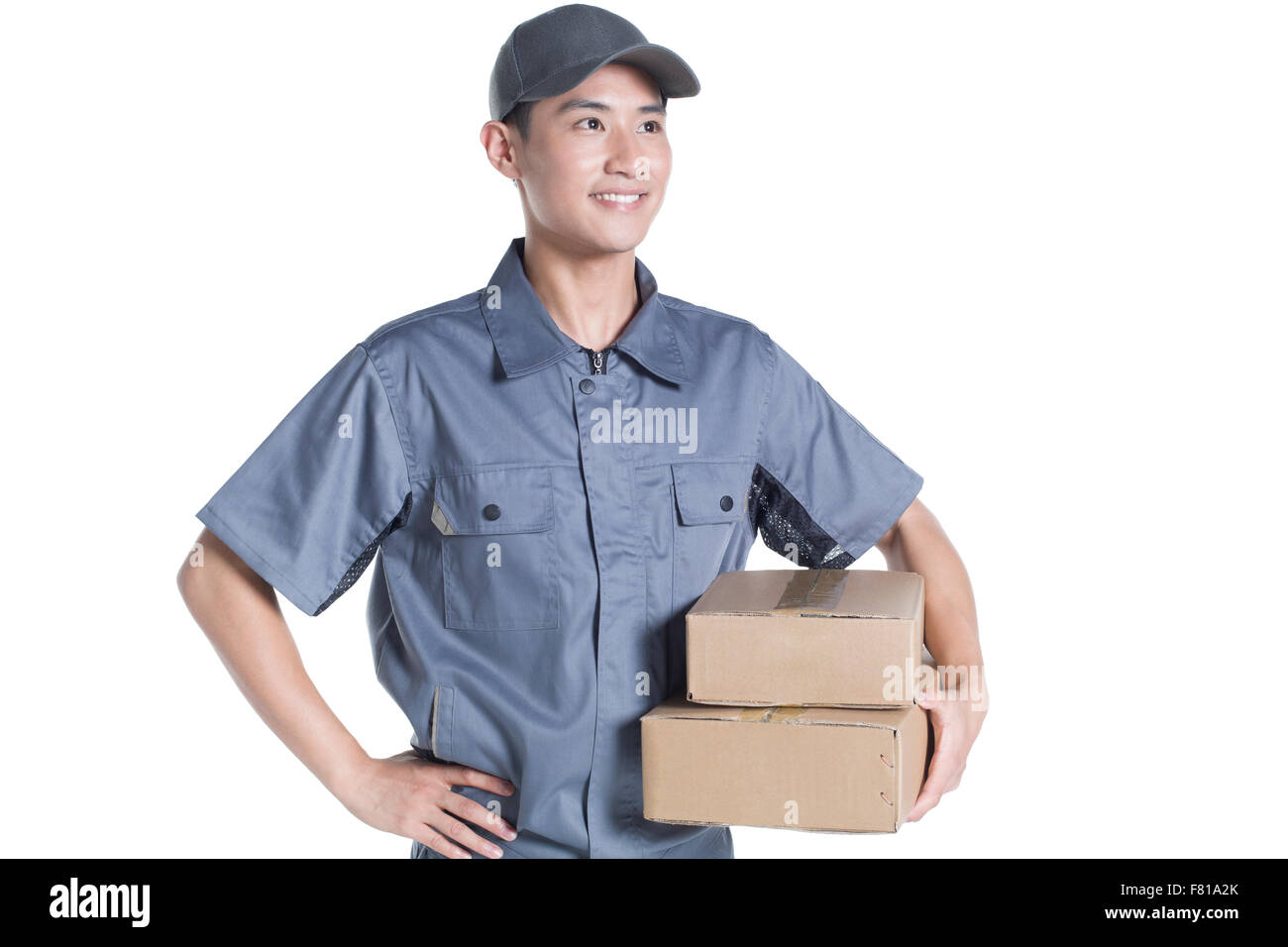 Delivery person delivering package Stock Photo - Alamy