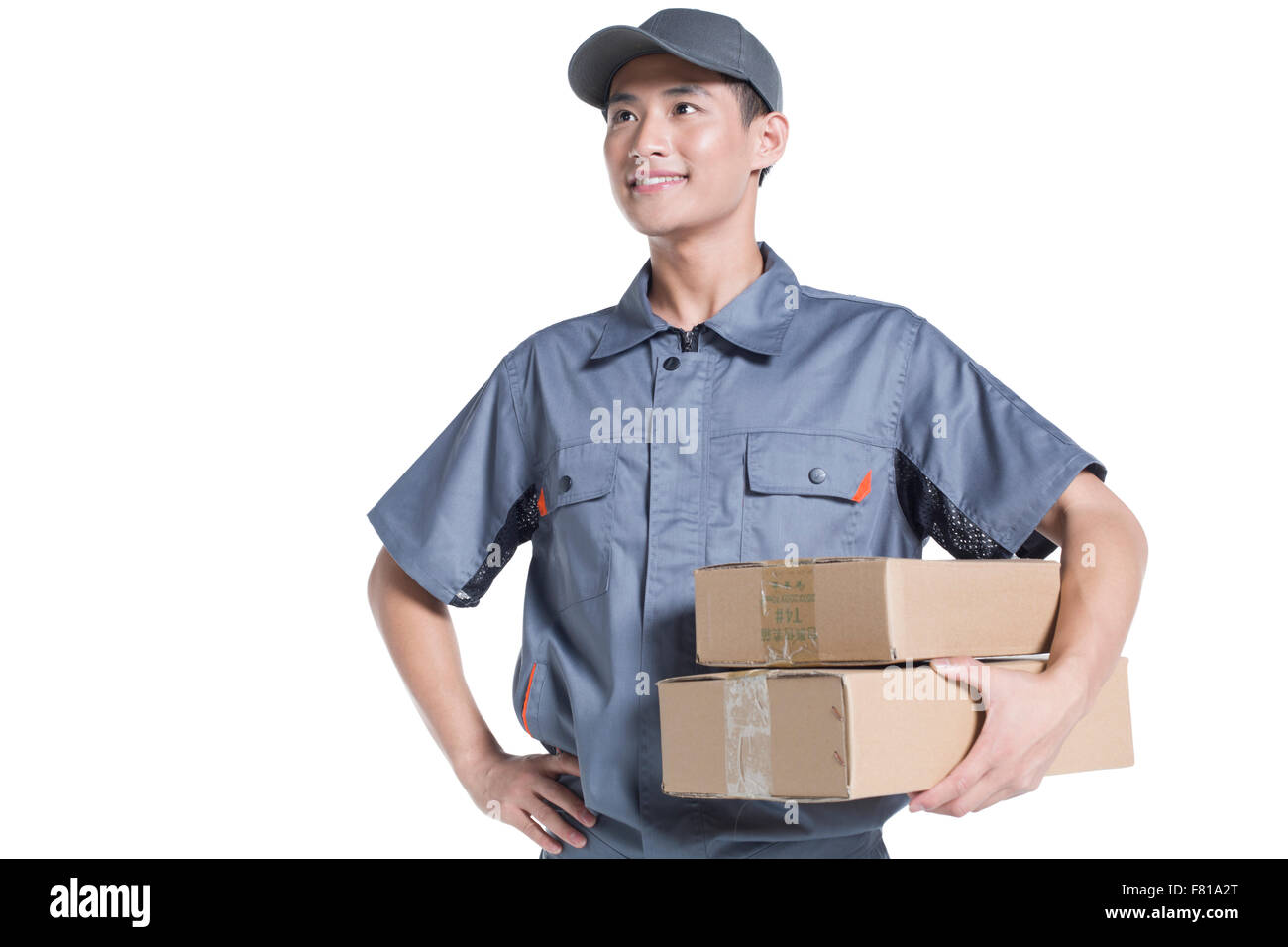 Delivery person delivering package Stock Photo - Alamy