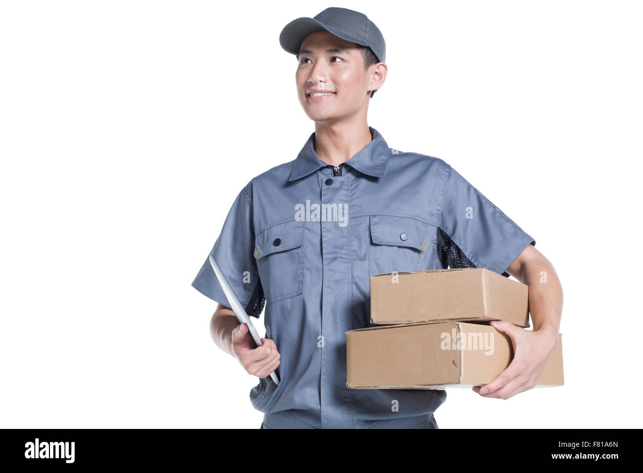 Delivery person delivering package Stock Photo - Alamy