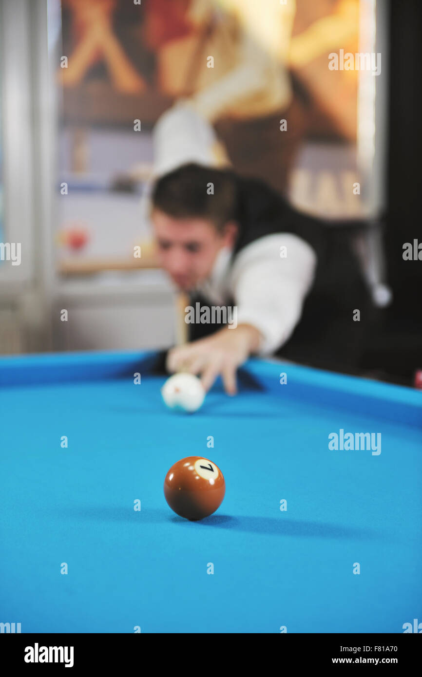 young pro billiard player finding best solution and right angle at ...