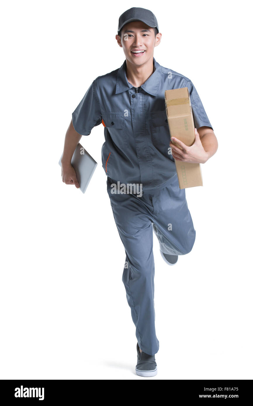 Delivery person delivering package Stock Photo - Alamy