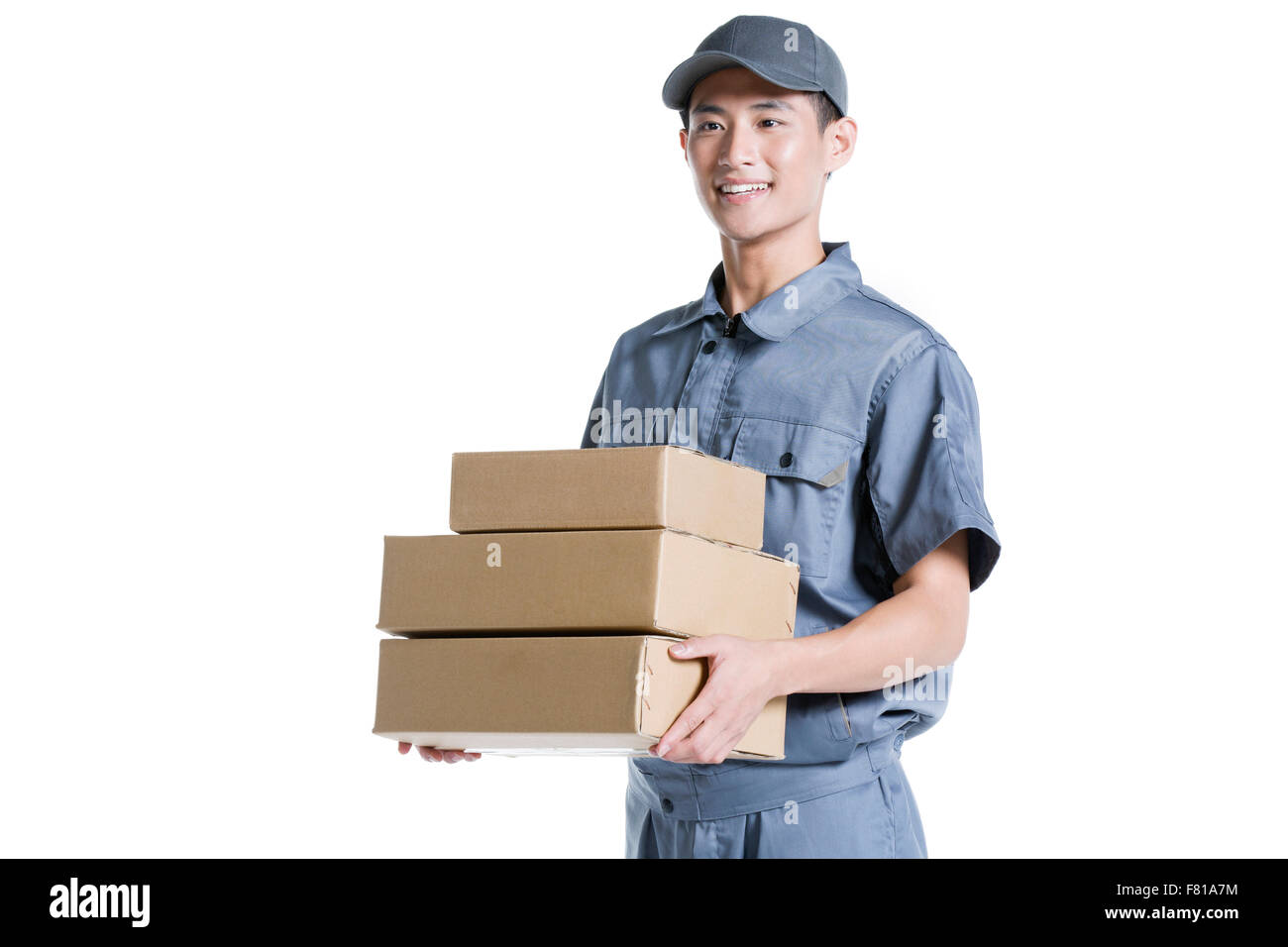 Delivery person delivering package Stock Photo - Alamy