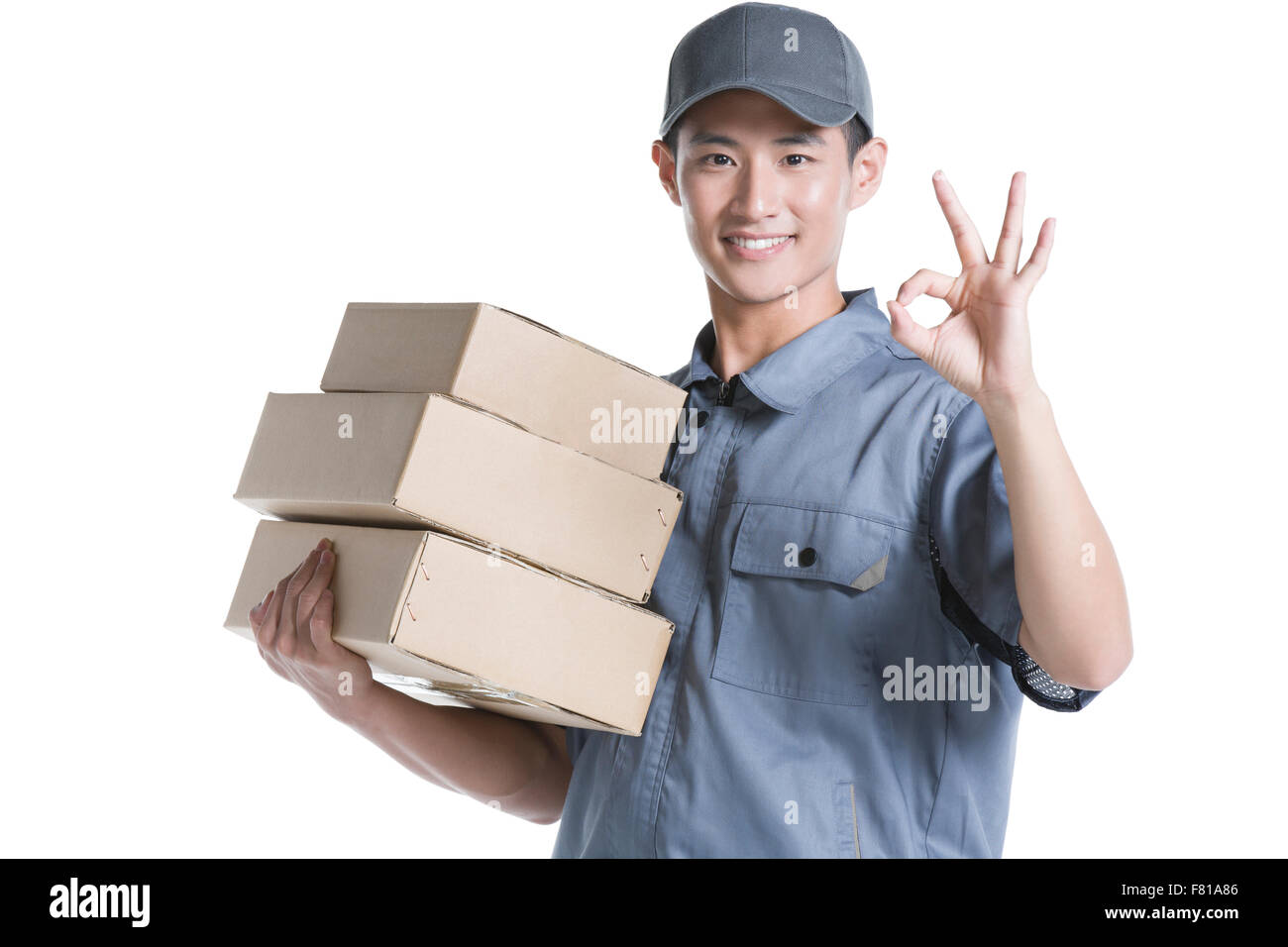 Delivery person delivering package Stock Photo - Alamy