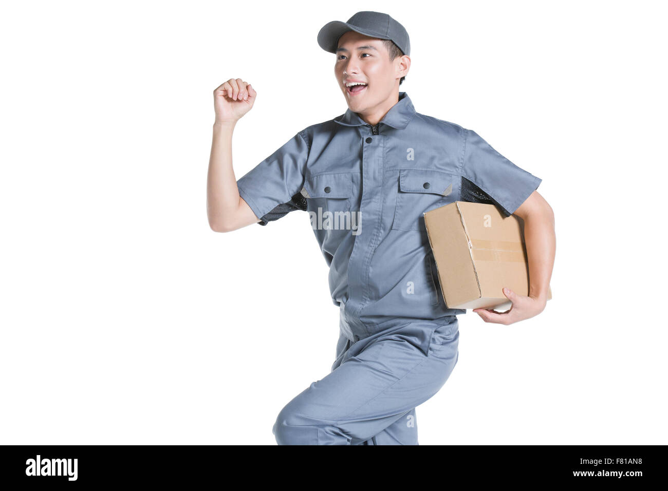 Delivery person delivering package Stock Photo - Alamy