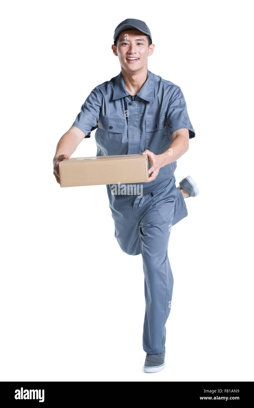 Delivery person delivering package Stock Photo - Alamy