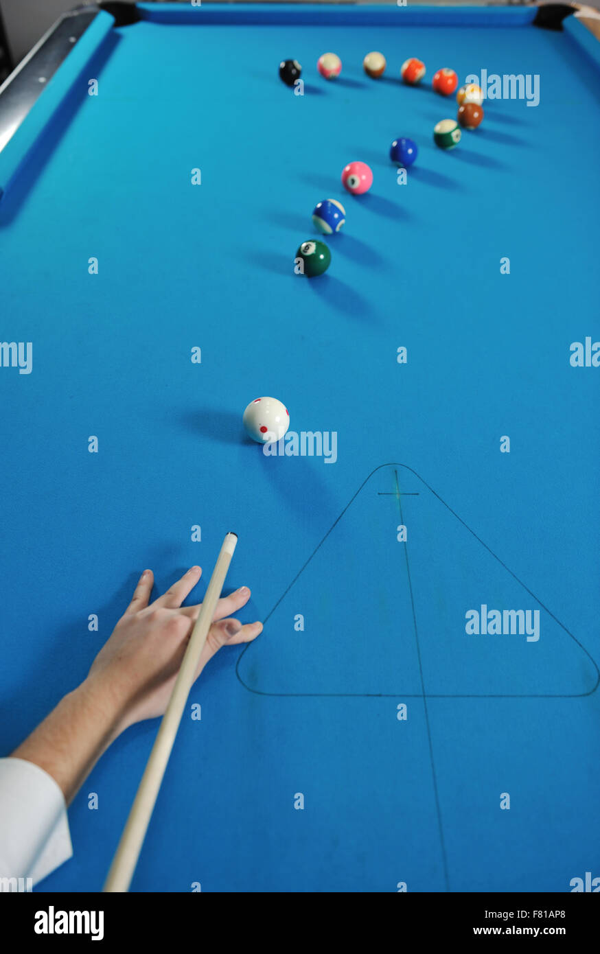 young pro billiard player finding best solution and right angle at ...