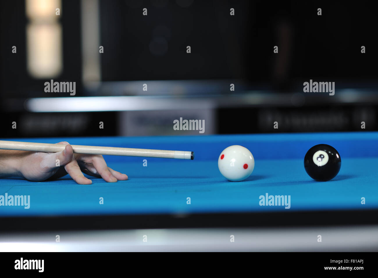 young pro billiard player finding best solution and right angle at ...