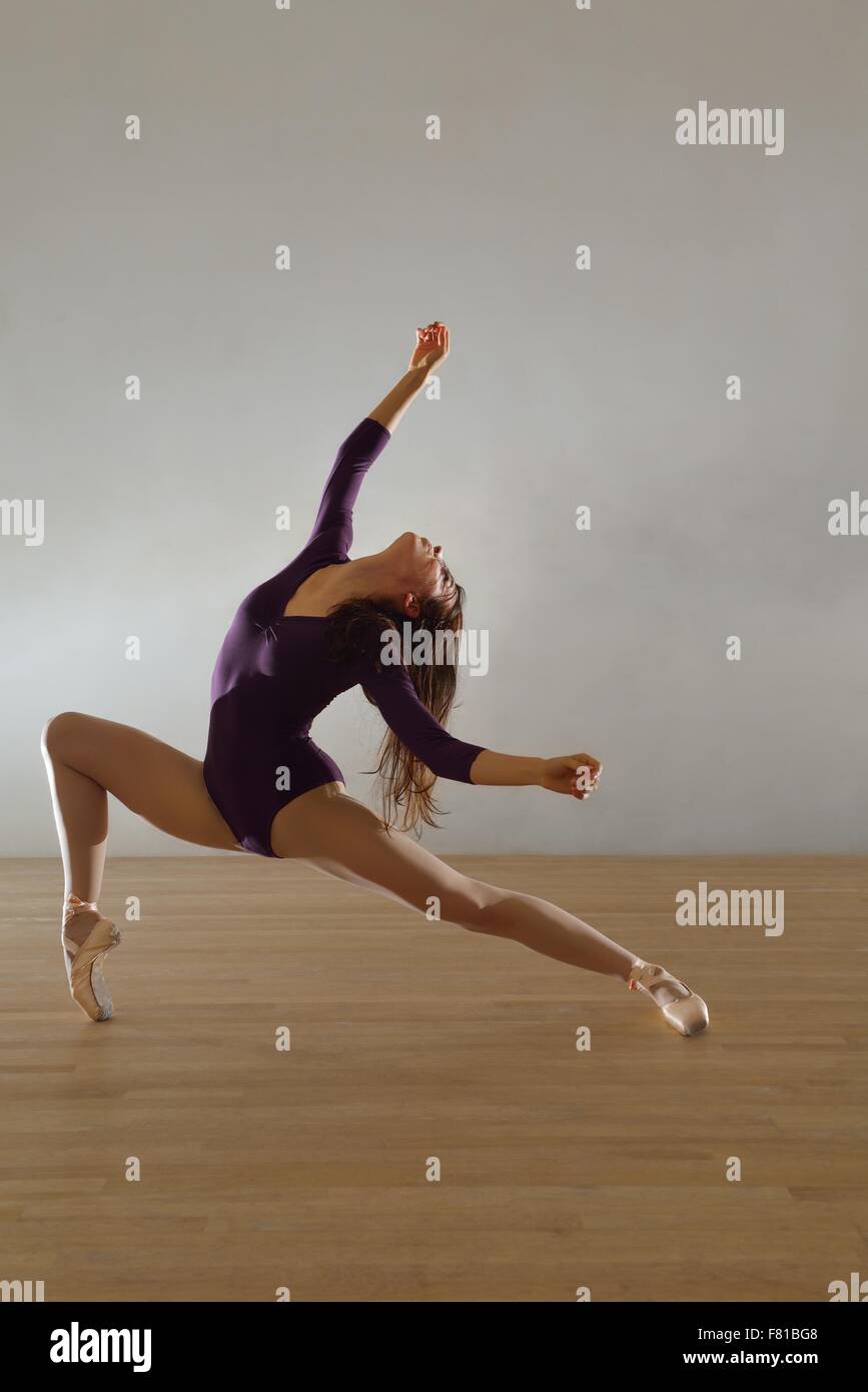 modern style ballet dancer posing and jumping on training Stock Photo ...