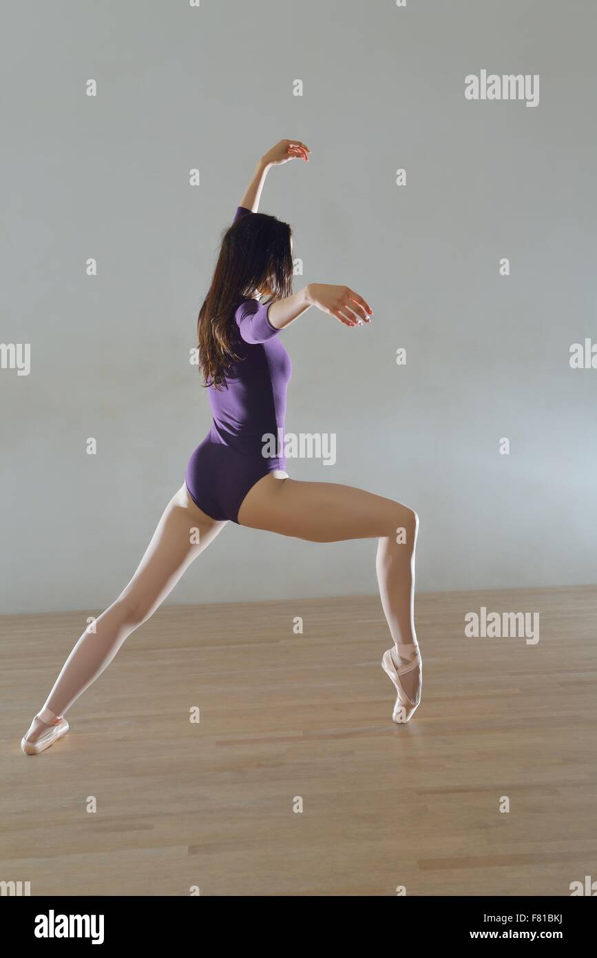 modern style ballet dancer posing and jumping on training Stock Photo ...