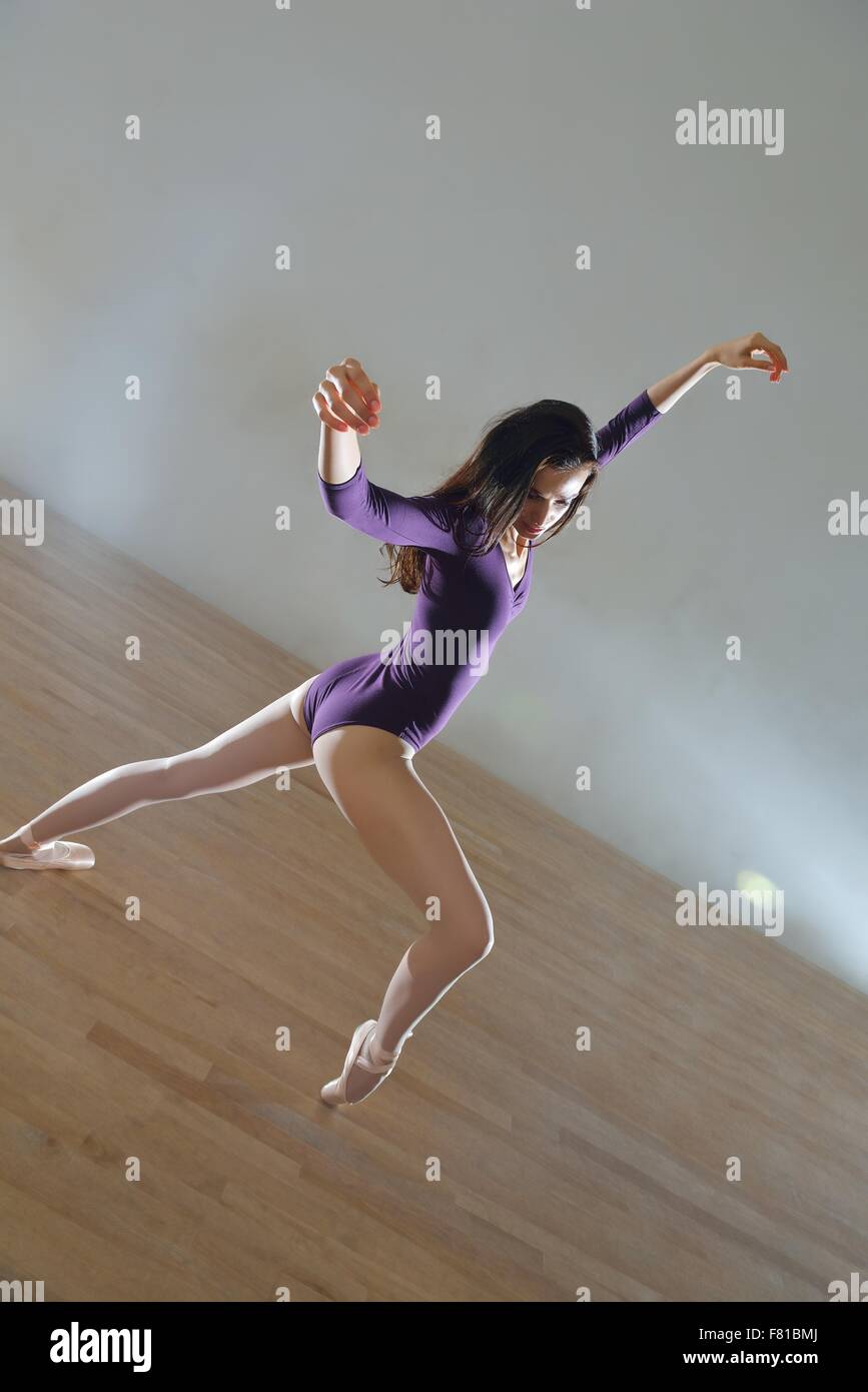 modern style ballet dancer posing and jumping on training Stock Photo ...