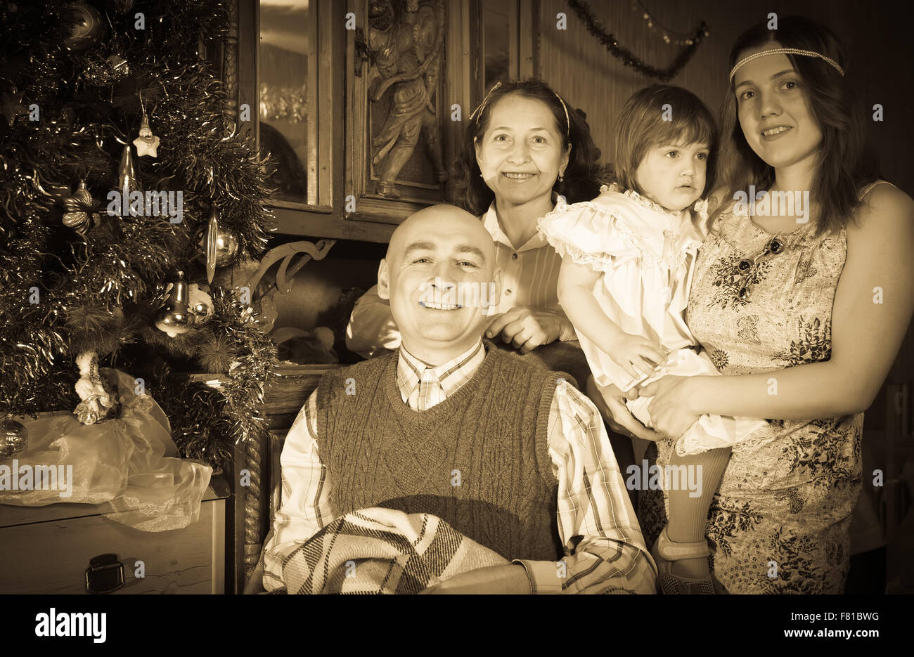 Retro photo of happy family of three generations posing for Christmas ...