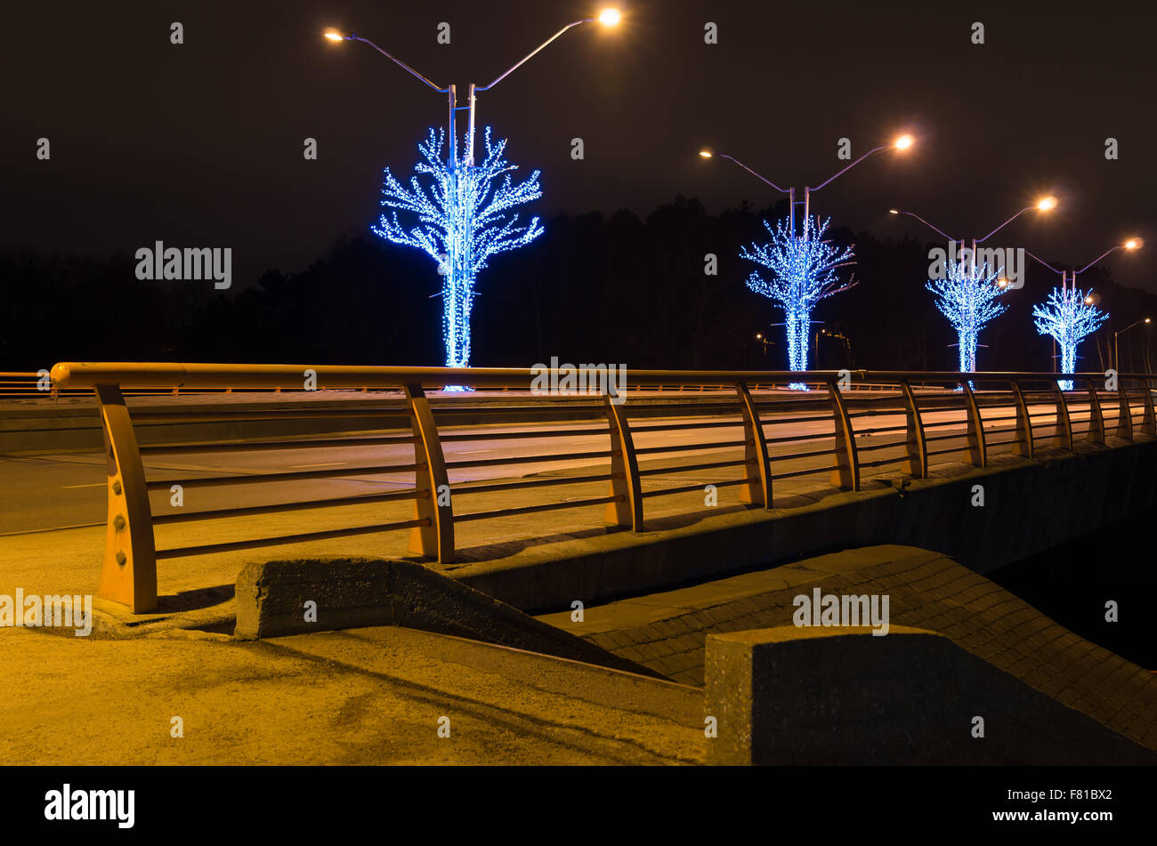 Bridge with yellow rail at night Stock Photo - Alamy