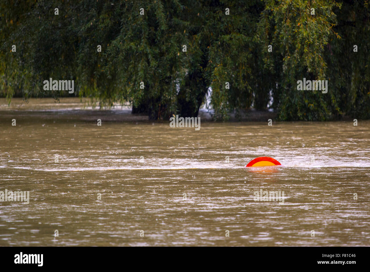 Flooded traffic sign in heavy rain Stock Photo - Alamy