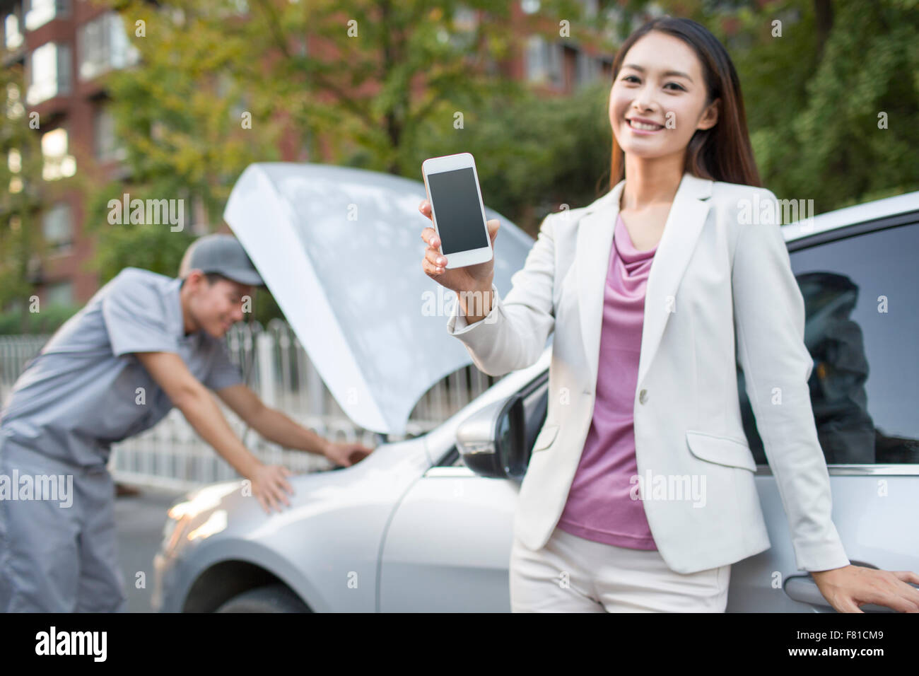 Auto mechanic and car owner Stock Photo - Alamy