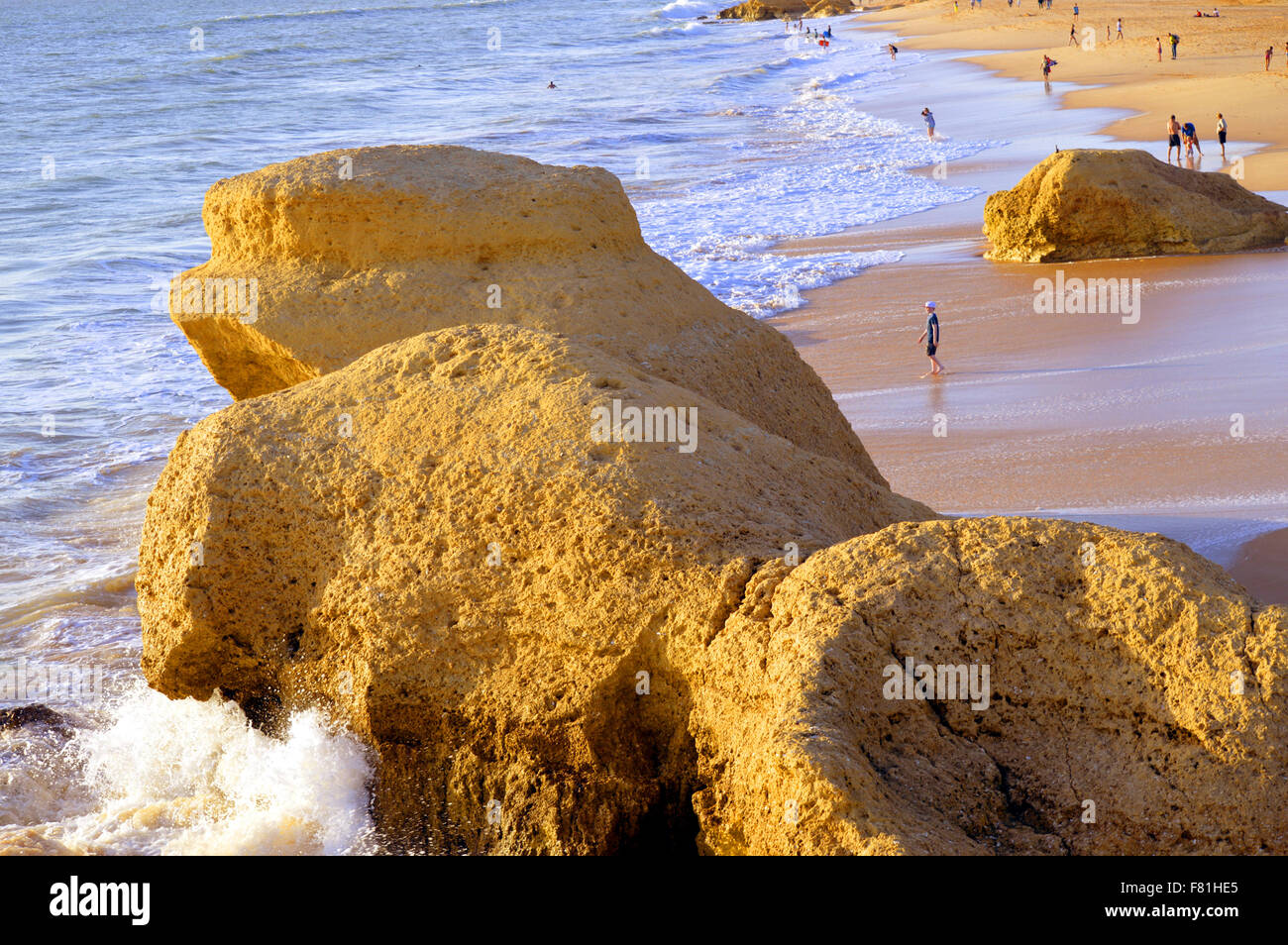 Tourists enjoying the evening sun on Praia Da Gale Beach Stock Photo ...