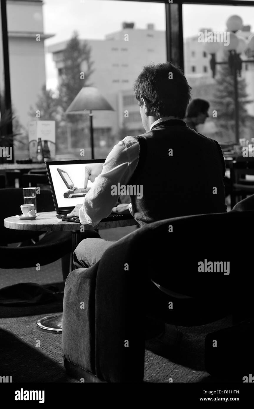 Working man sitting in the background Black and White Stock Photos ...