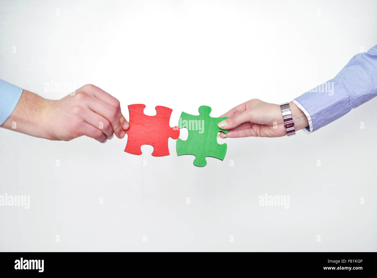 Group of business people assembling jigsaw puzzle and represent team ...