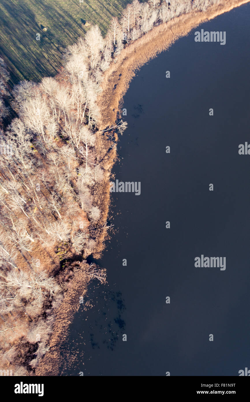 A Lake and it's shoreline in fall Stock Photo - Alamy