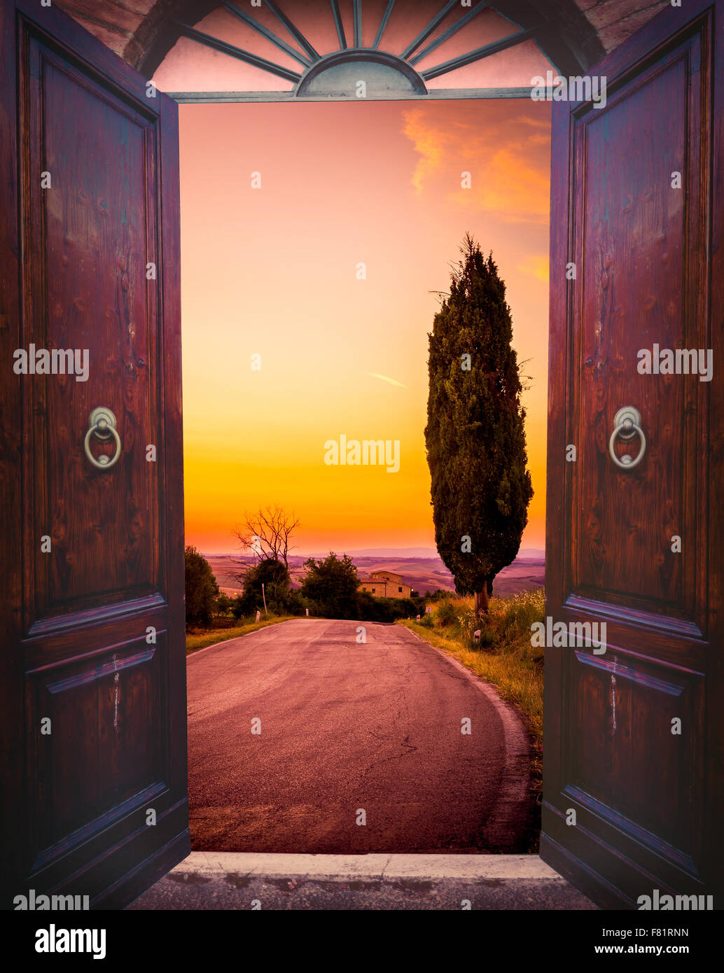 Old open door and cypress tree down the country road Stock Photo - Alamy