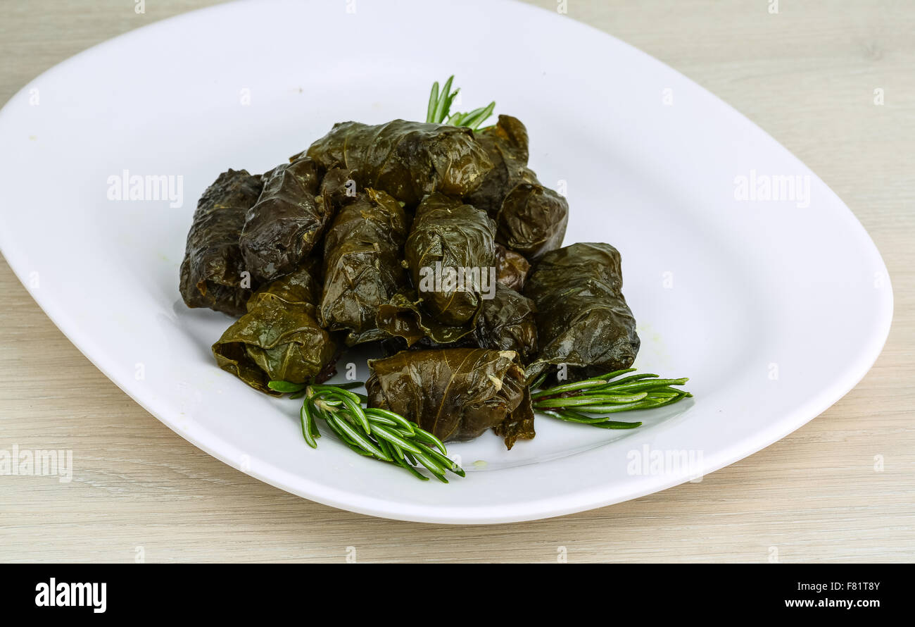 Greek dolma in grape leaves with meat served rosemary Stock Photo - Alamy